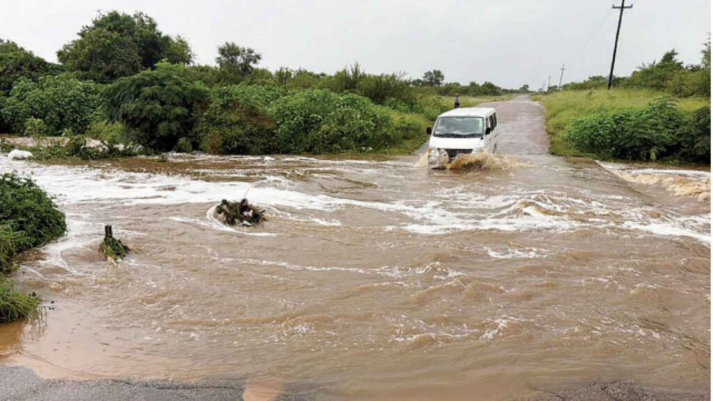 TRAPPED BY THE FLOOD . . . Rains flood homes, disrupt schools and raise ...